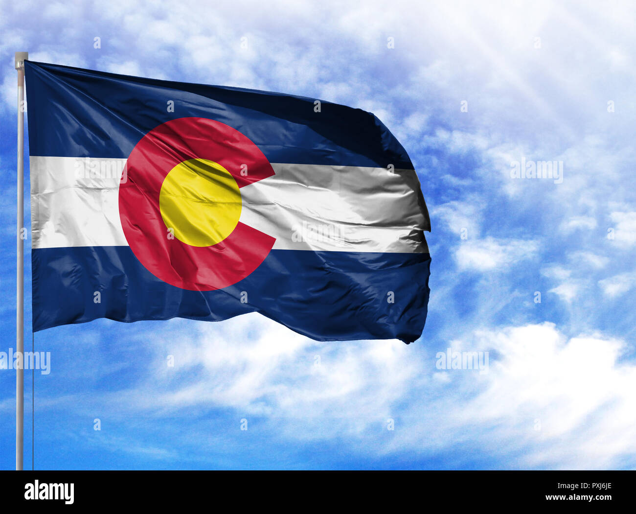 flag State of Colorado on a flagpole in front of blue sky Stock Photo ...