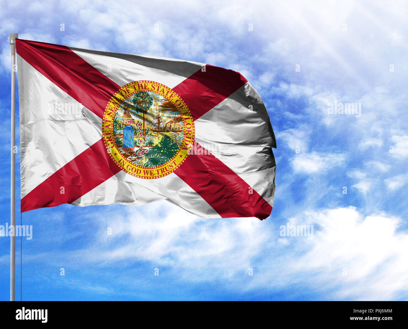 flag State of Florida on a flagpole in front of blue sky Stock Photo ...