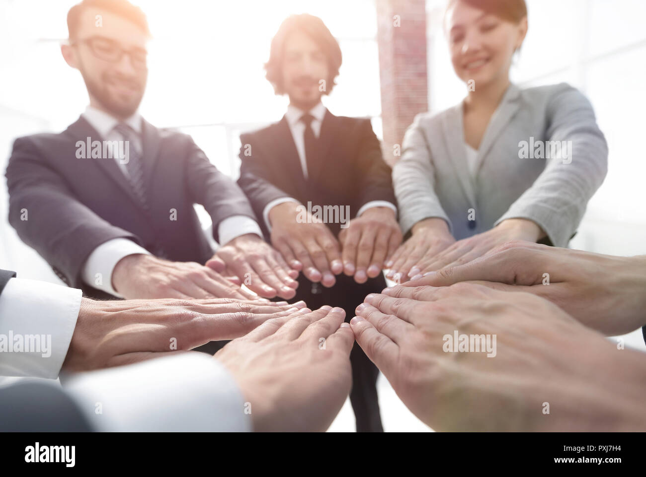 closeup.business people giving each other their hands.the concept of ...