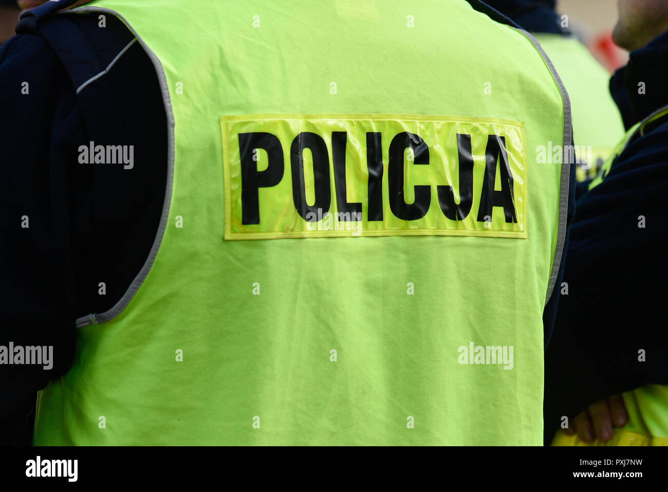 Police sign/logo on the back of green police uniform west Stock Photo ...