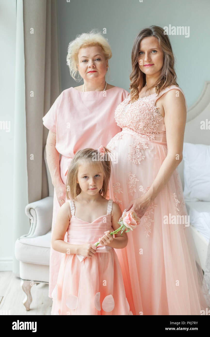 Female generation. Mother daughter grandmother. Older woman, pregnant ...