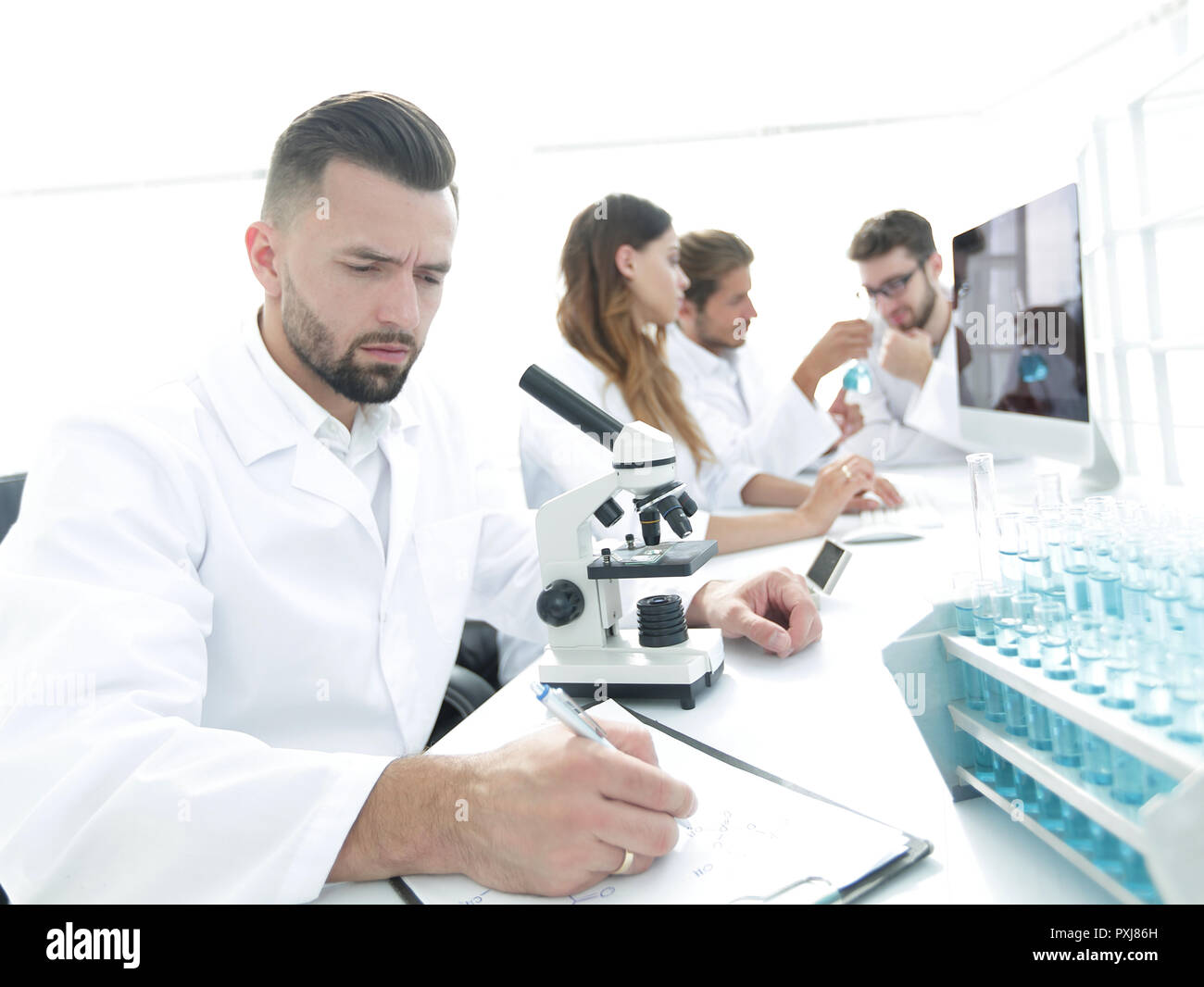 young scientist works in the lab.concept of teamwork Stock Photo - Alamy