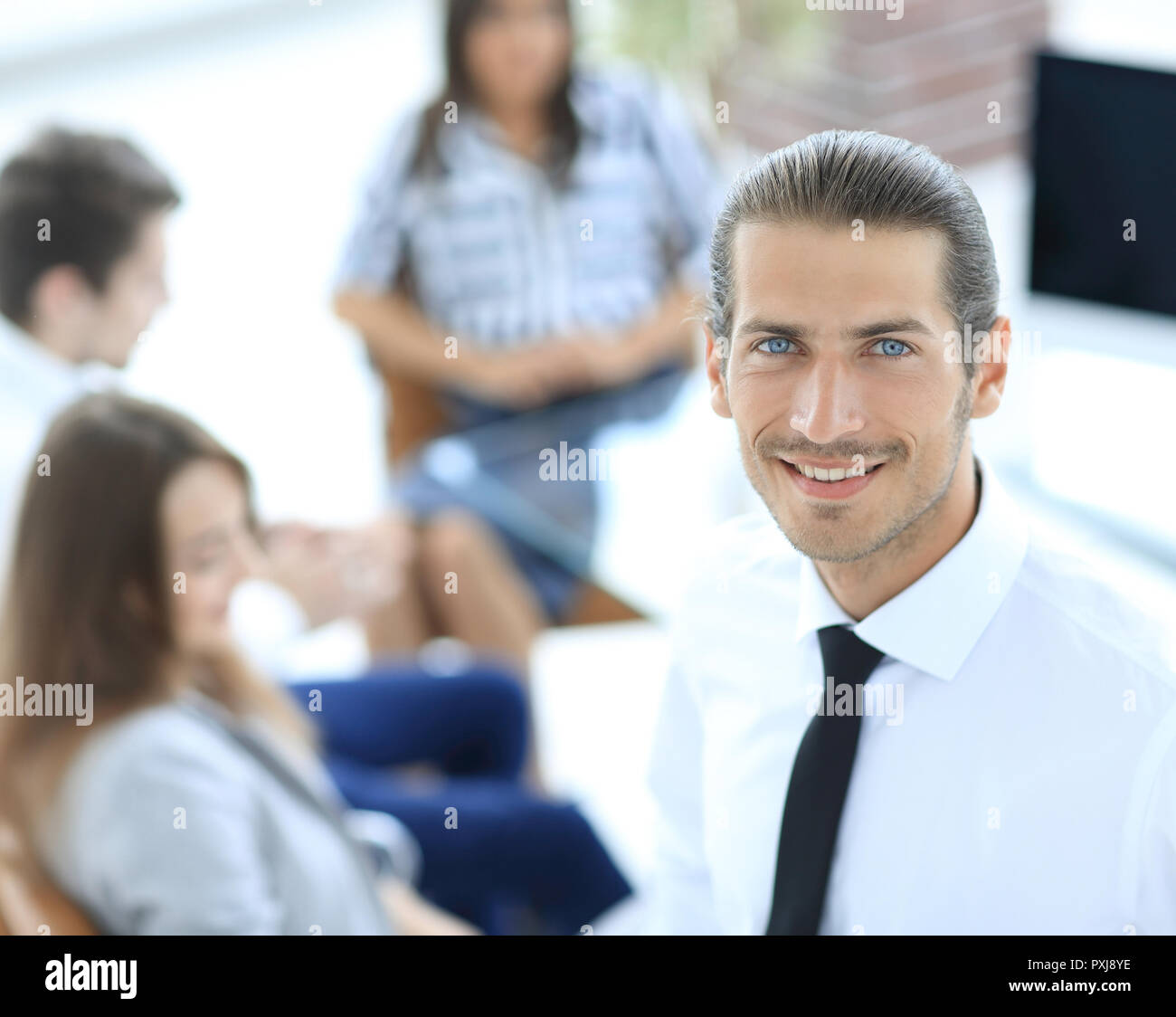 successful young business men on blurred background.photo with copy ...