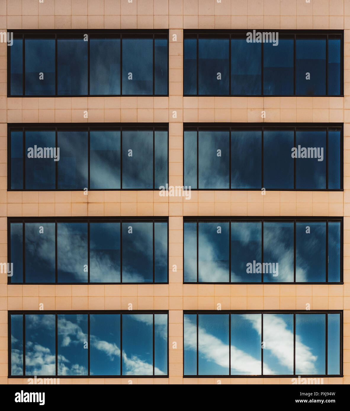 Clouds reflected in windows Stock Photo - Alamy