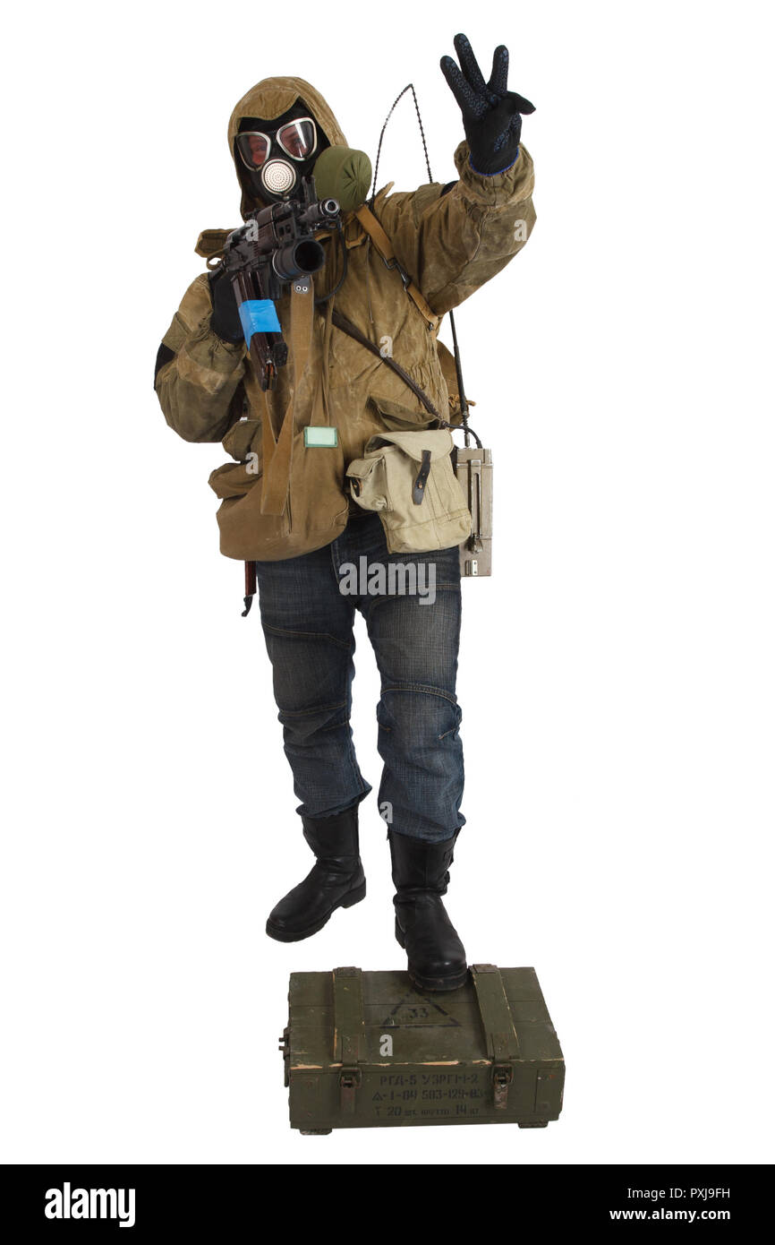 Post-apocalyptic fiction concept - stalker in gas mask with weapon and ...