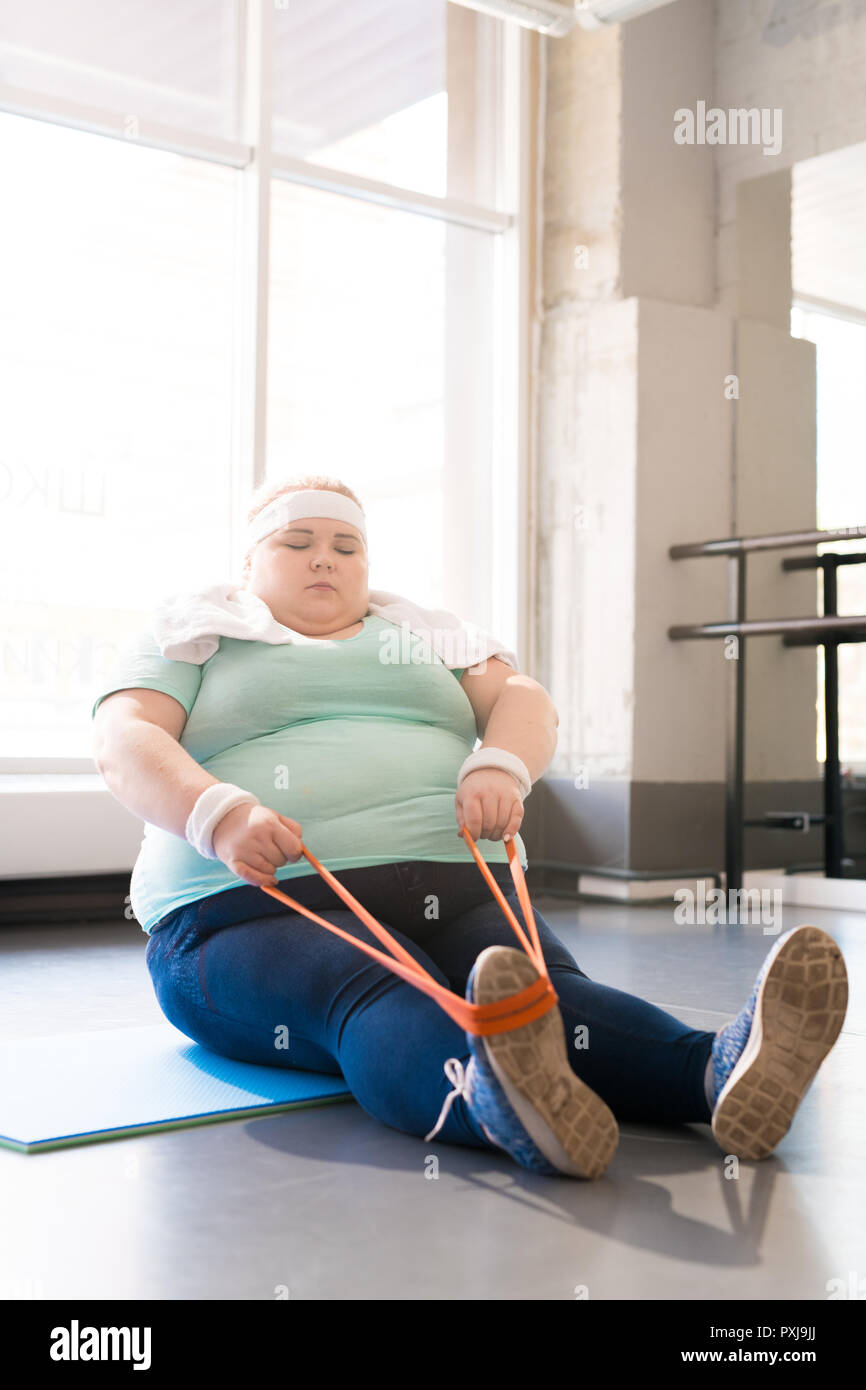 Overweight Woman Training in Fitness Class Stock Photo - Alamy