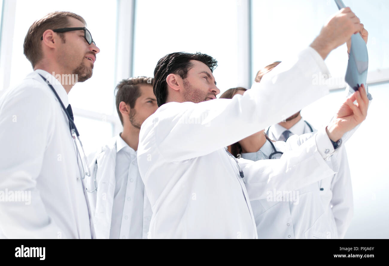 group of doctors discussing the x-ray. the concept of teamwork Stock ...