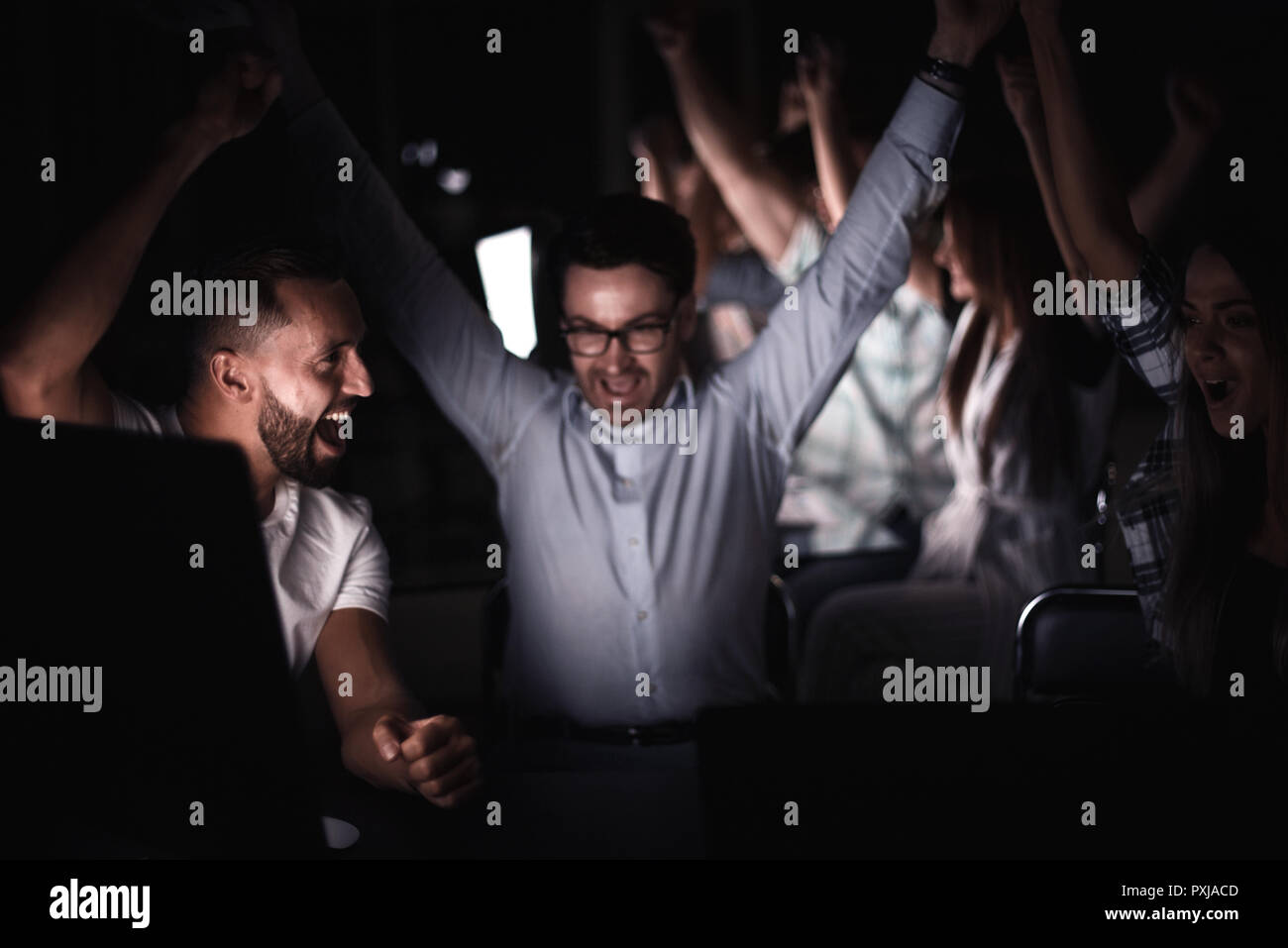 triumphant business team at the Desk.the concept of teamwork Stock ...