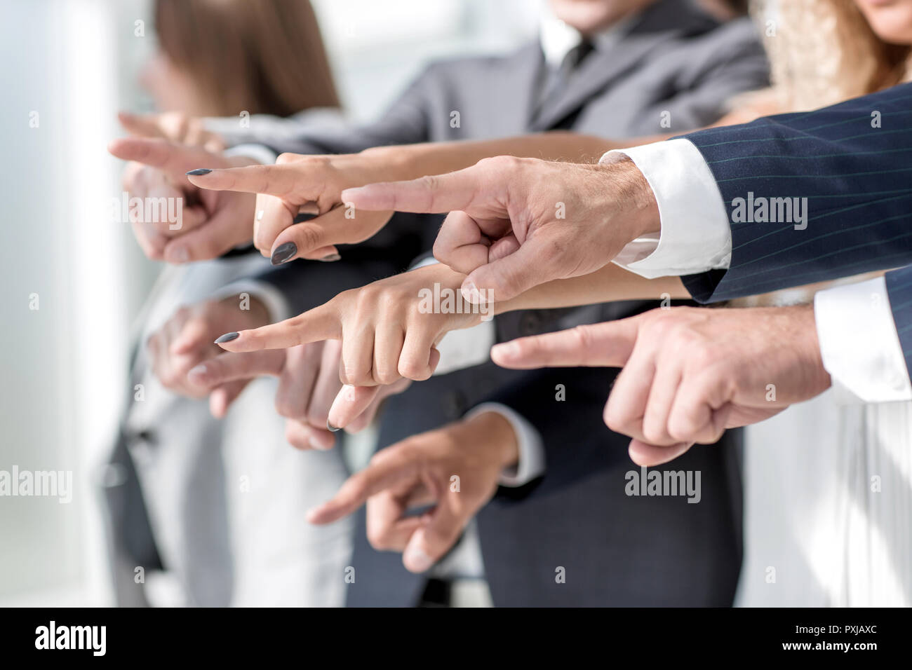 side view. hands the business team pointing at you Stock Photo - Alamy