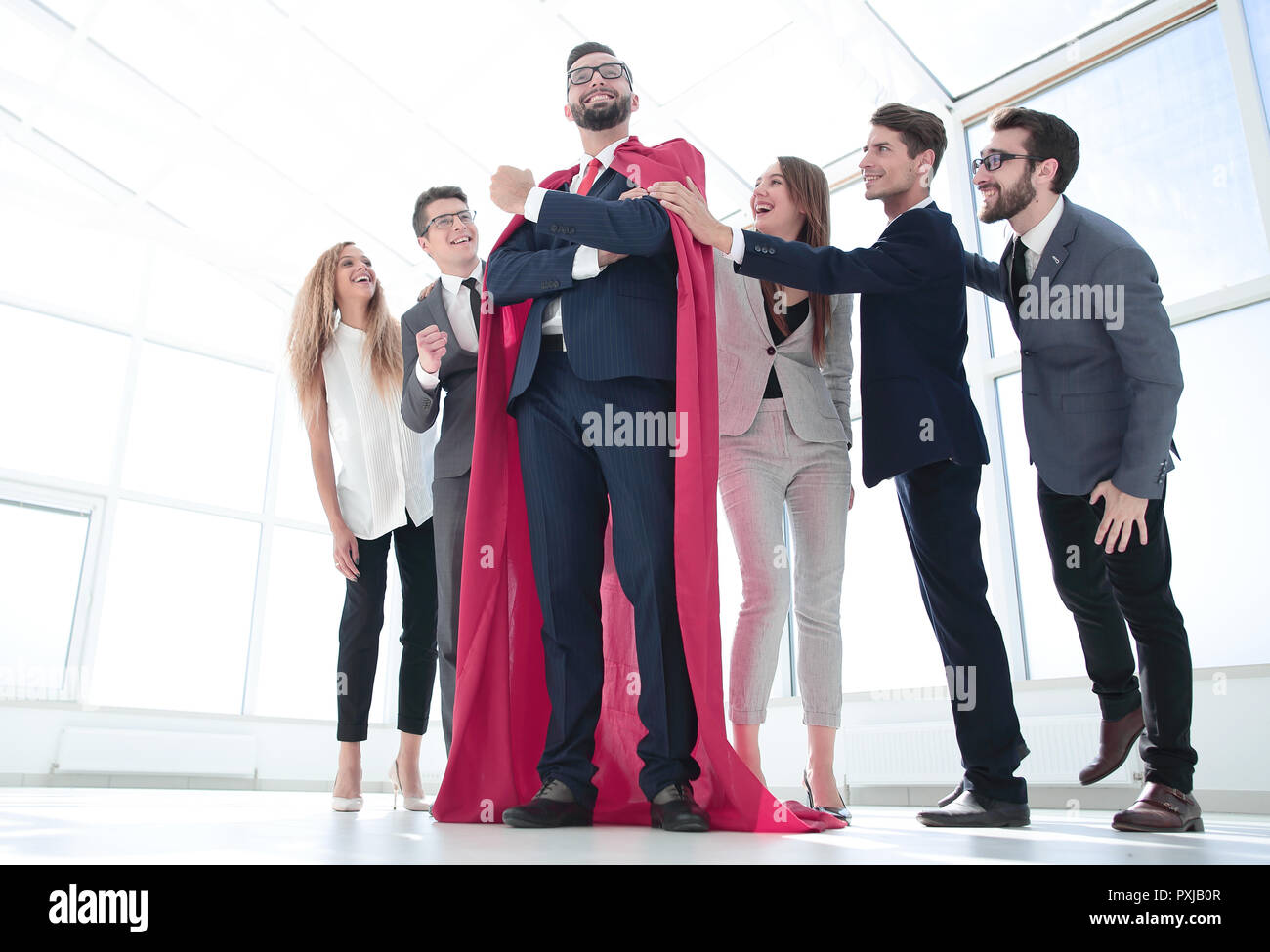 boss is a superhero and the business team is standing together Stock ...
