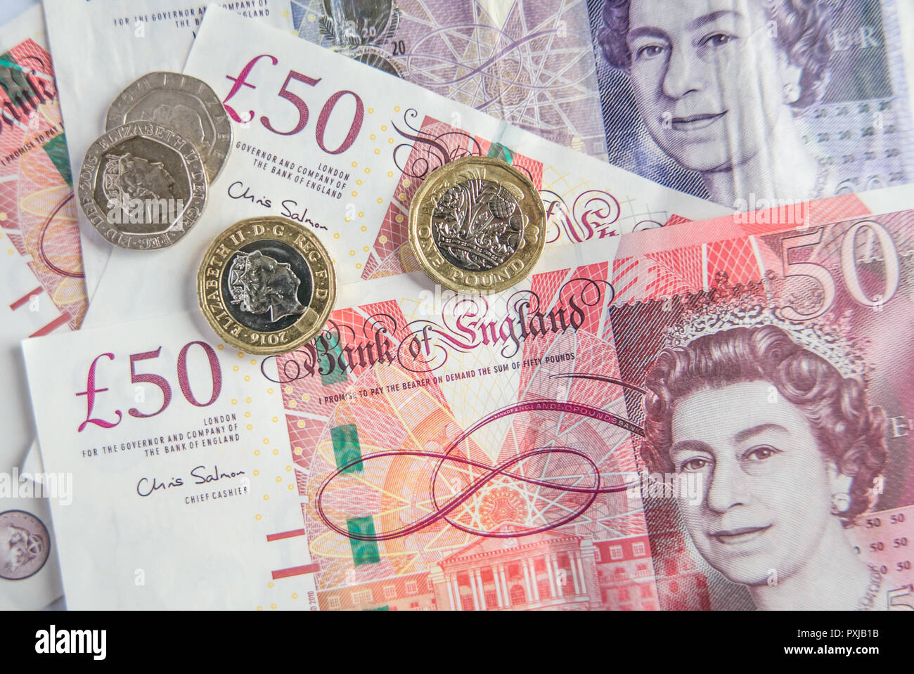 British pound notes and coins financial background Stock Photo - Alamy