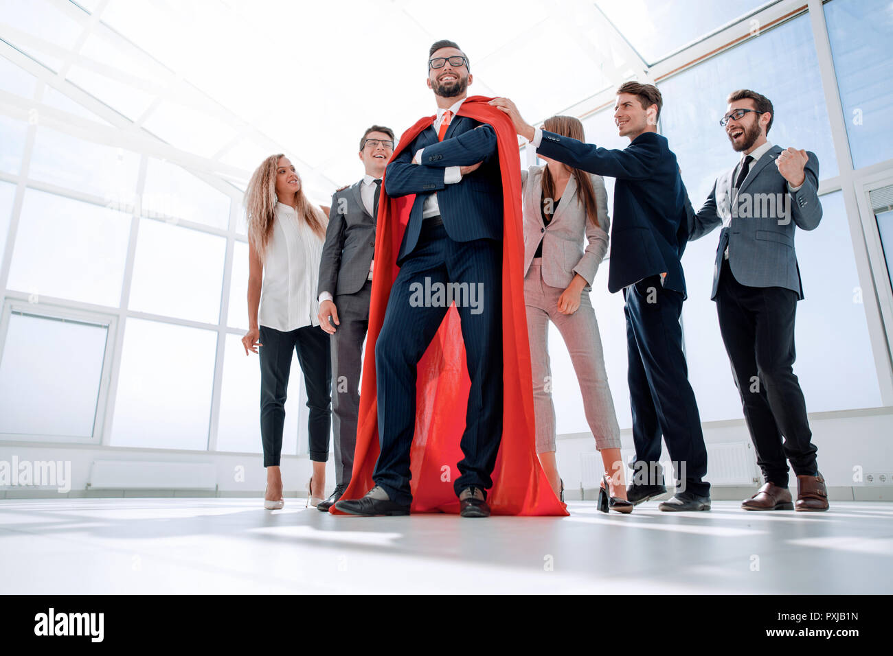 boss is a superhero and the business team is standing together Stock ...