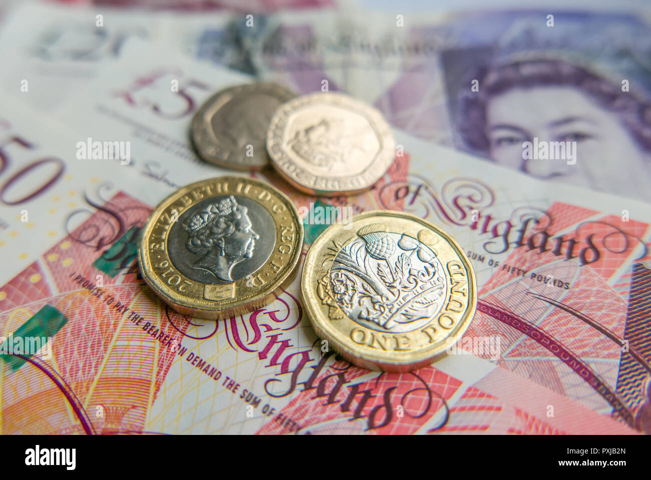 British pound notes and coins financial background close up Stock Photo ...