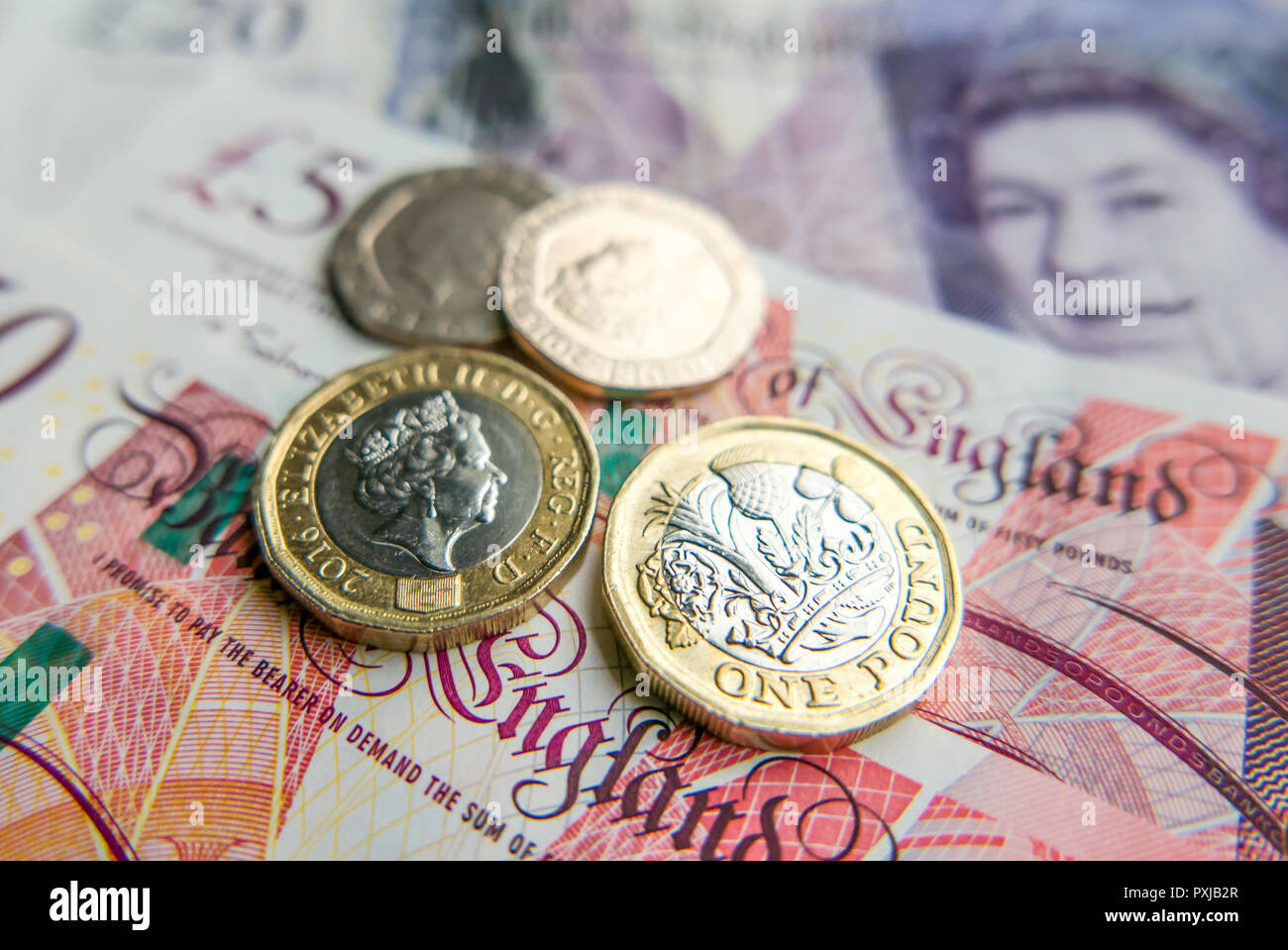 British pound notes and coins financial background close up Stock Photo ...