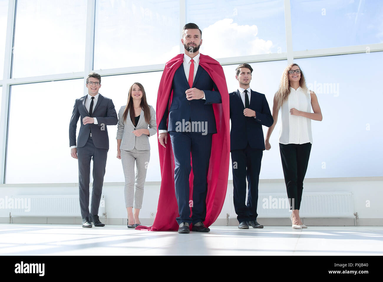 businessman-superhero and business team standing in the office Stock ...