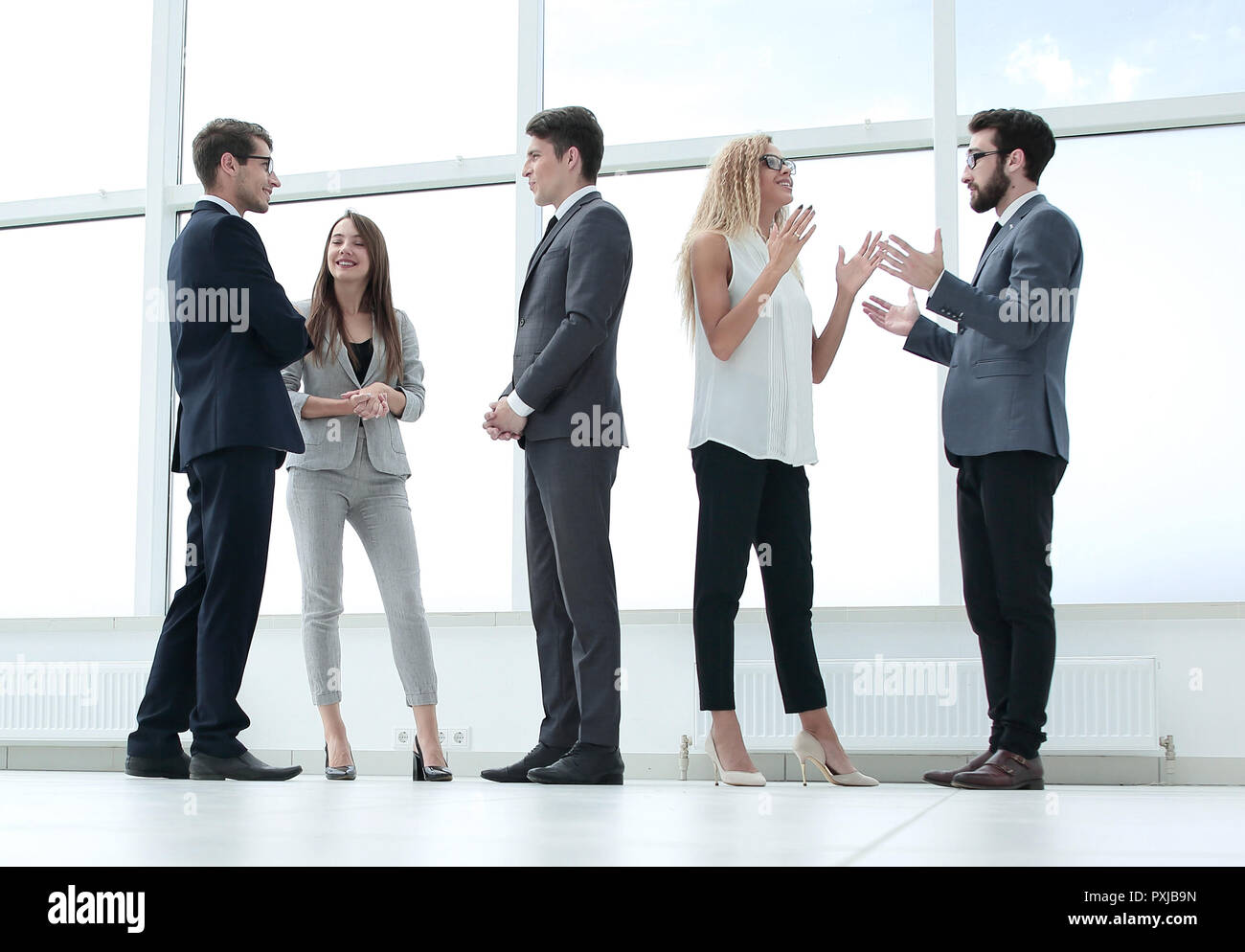 group of business people standing in a spacious hall Stock Photo - Alamy