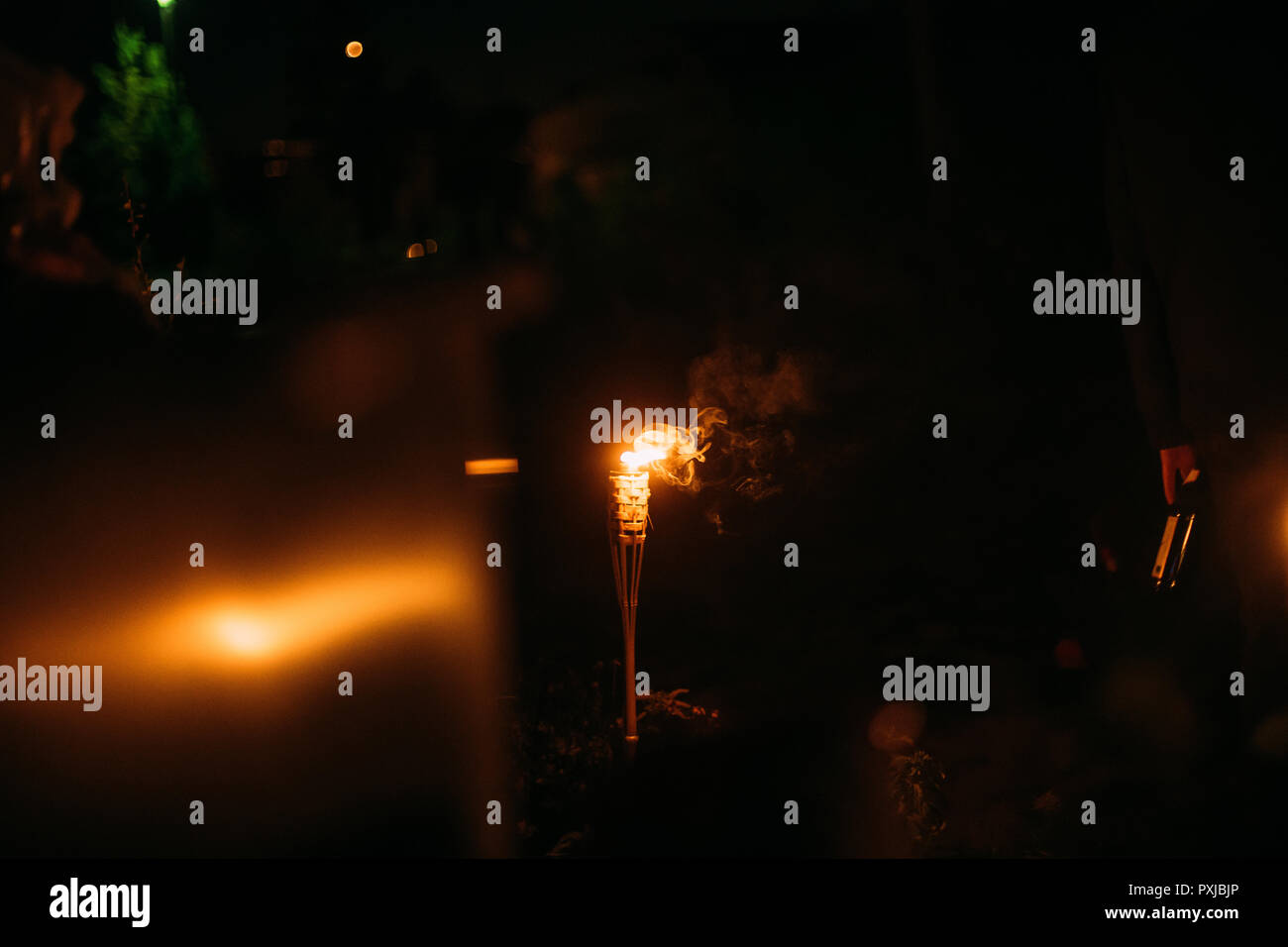 Tiki torch at night hi-res stock photography and images - Alamy