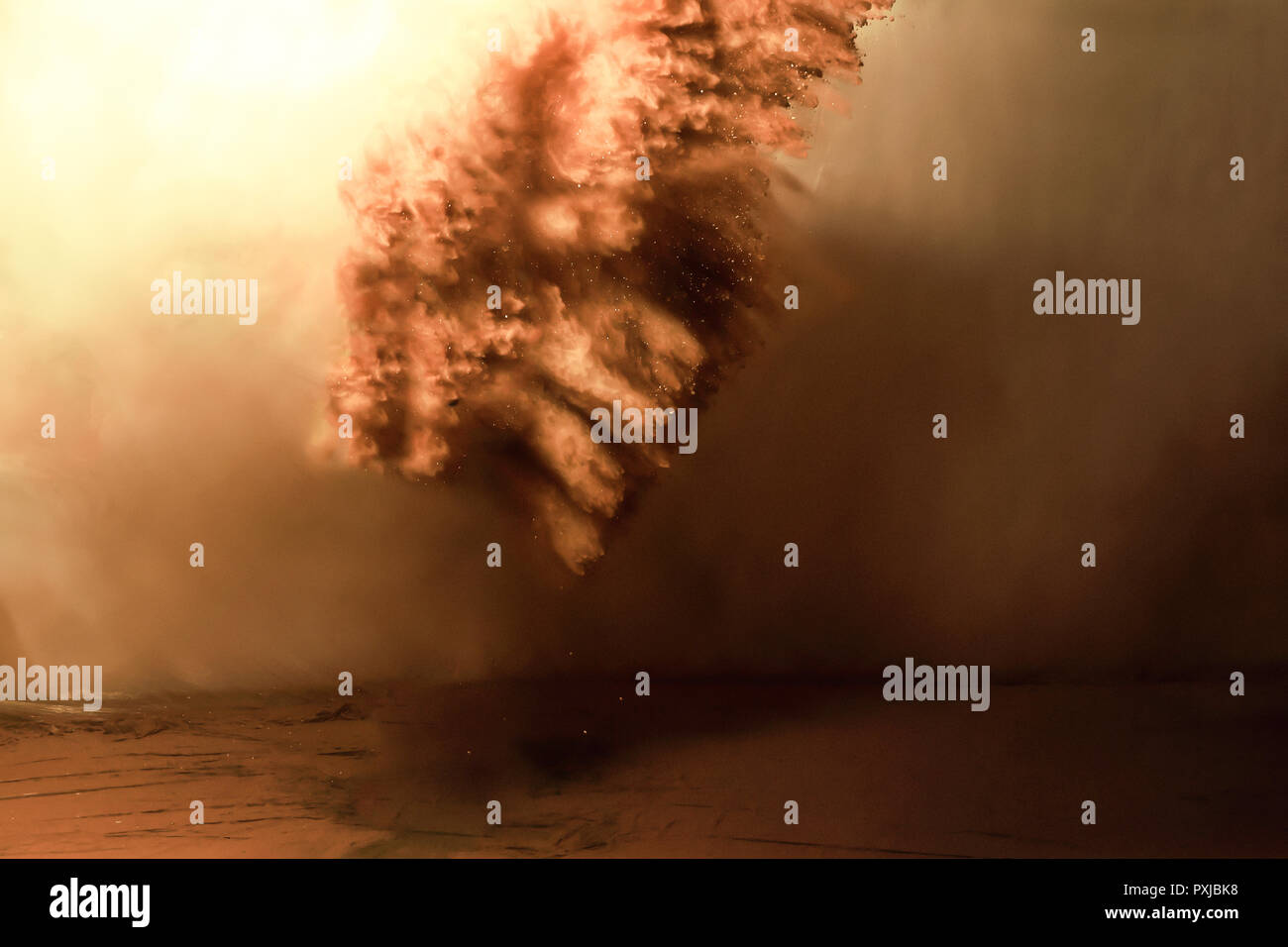 Powder or flour in motion exploded in studio environment Stock Photo ...