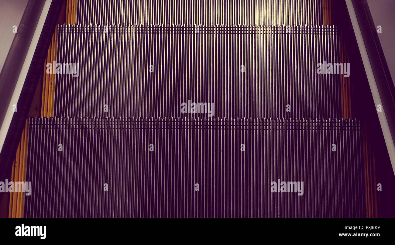 abstract escalator in shopping mall, Moving up staircase, yellow bands ...