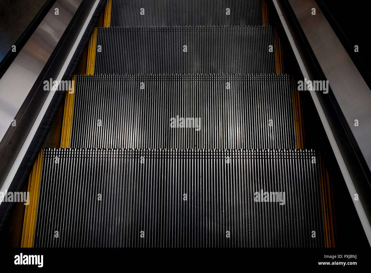 abstract escalator in shopping mall, Moving up staircase, yellow bands ...