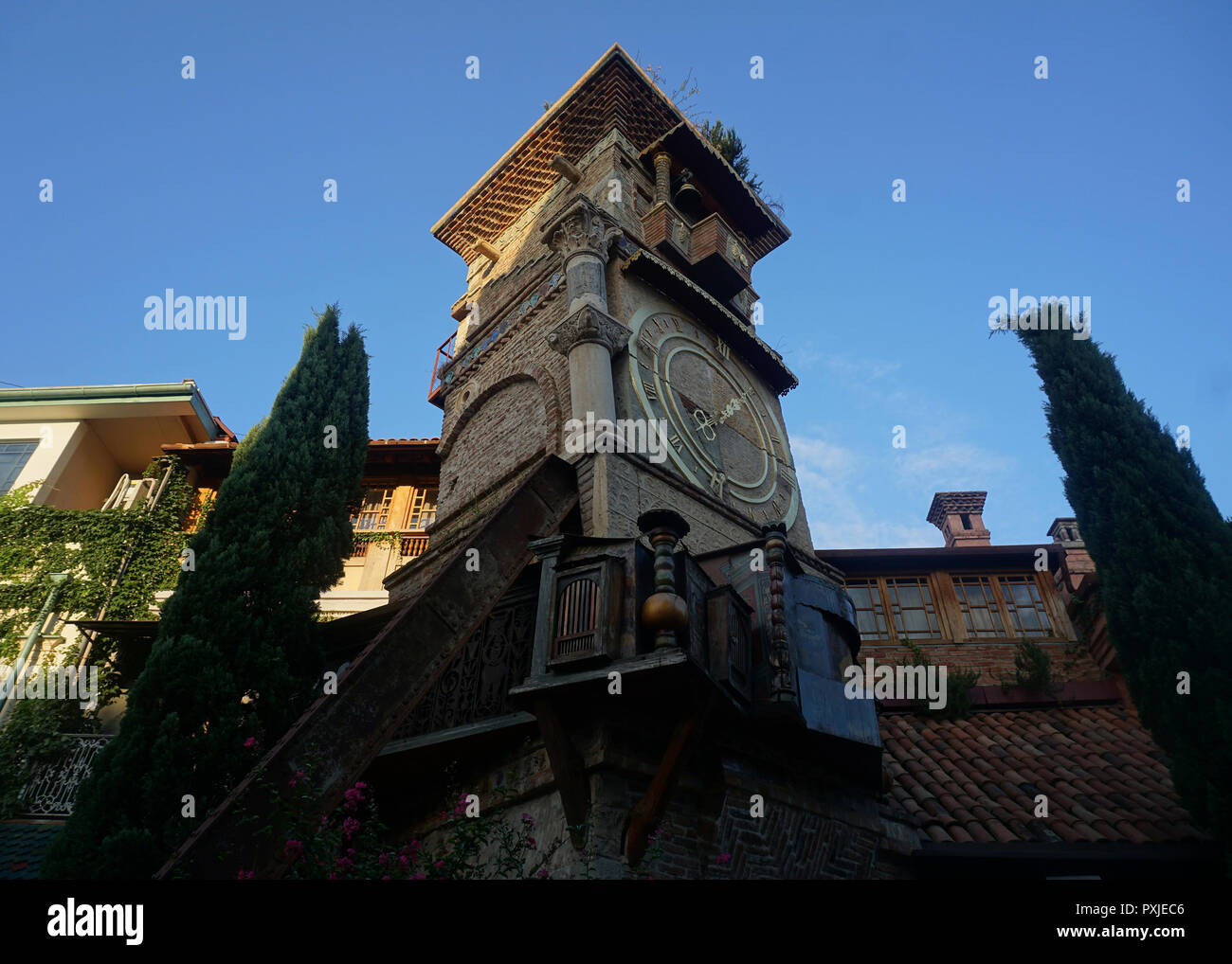 Tbilisi Leaning Rustic Clock Tower with Blue Sky View Stock Photo - Alamy