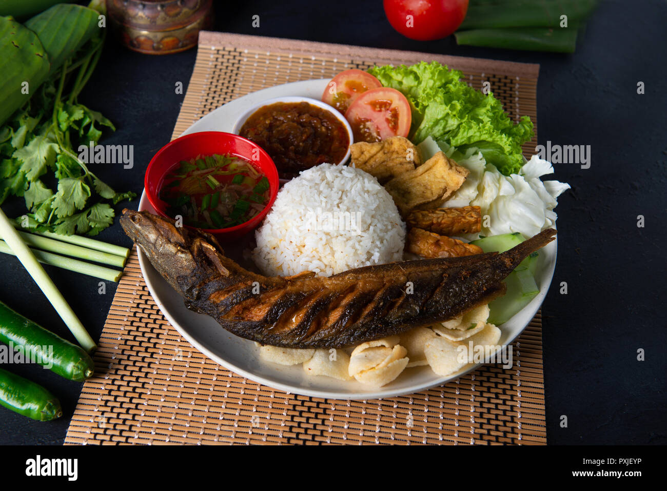 traditional malay cat fish rice with sambal Stock Photo - Alamy