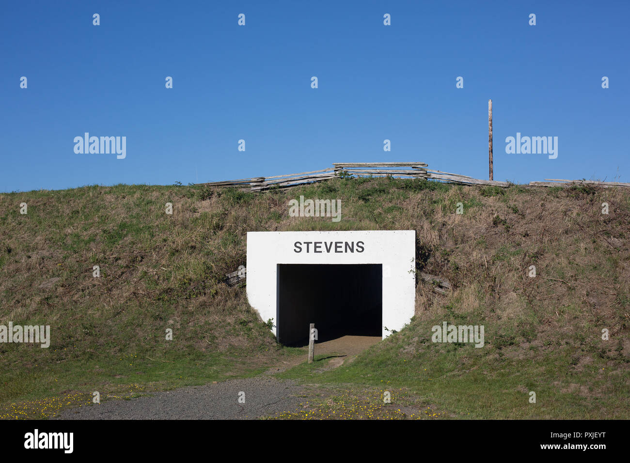 A sign leading over a tunnel leading to Fort Stevens in Hammond, Oregon ...