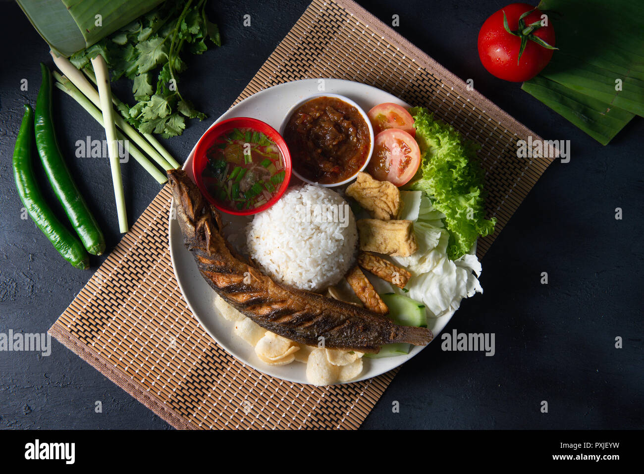 traditional malay cat fish rice with sambal Stock Photo - Alamy