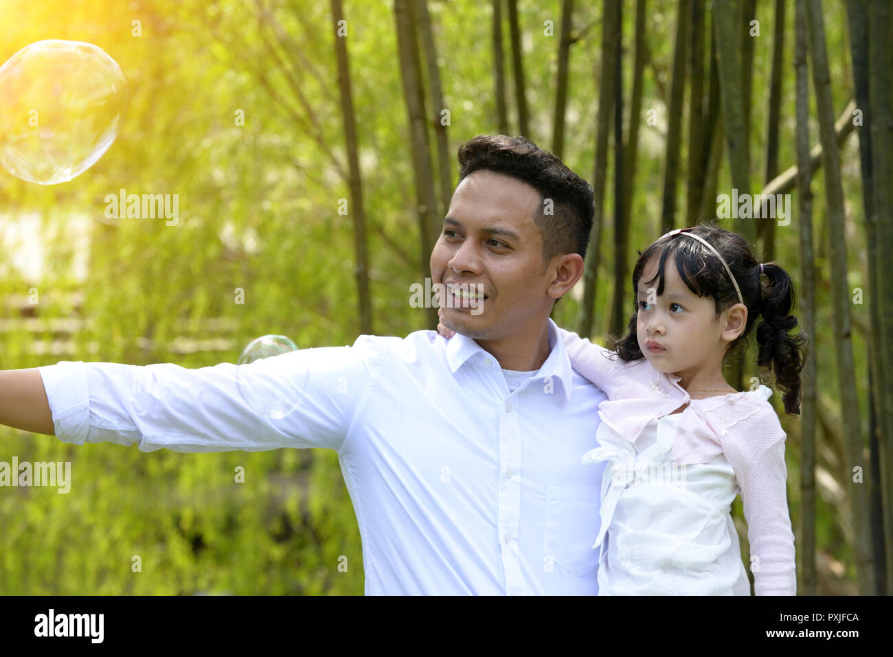 malay muslim father and child outdoor Stock Photo - Alamy