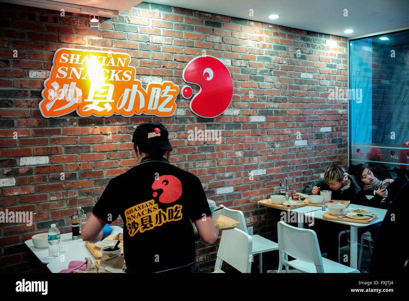 New York, USA. 21st Oct, 2018. People enjoy their meal in Shaxian ...