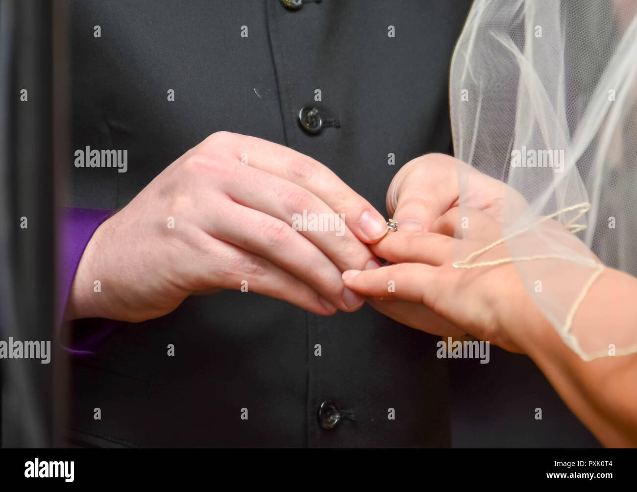 Putting on wedding ring hi-res stock photography and images - Alamy