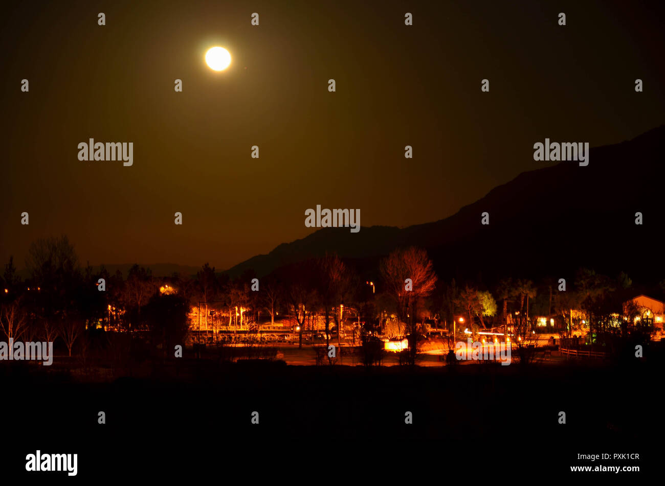Shinning moon on town Stock Photo - Alamy