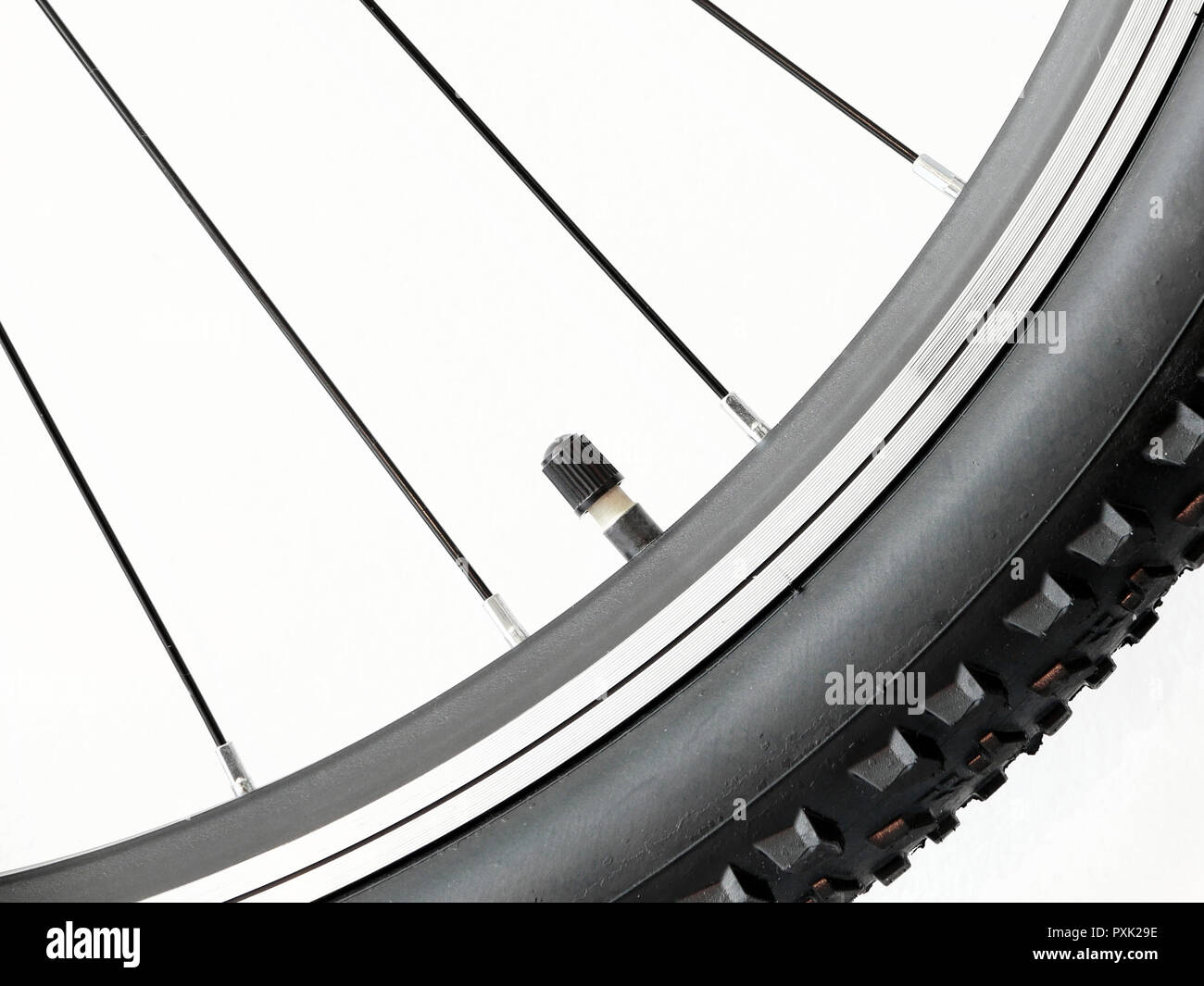 Valce on bicycle wheel isolated on white Stock Photo - Alamy