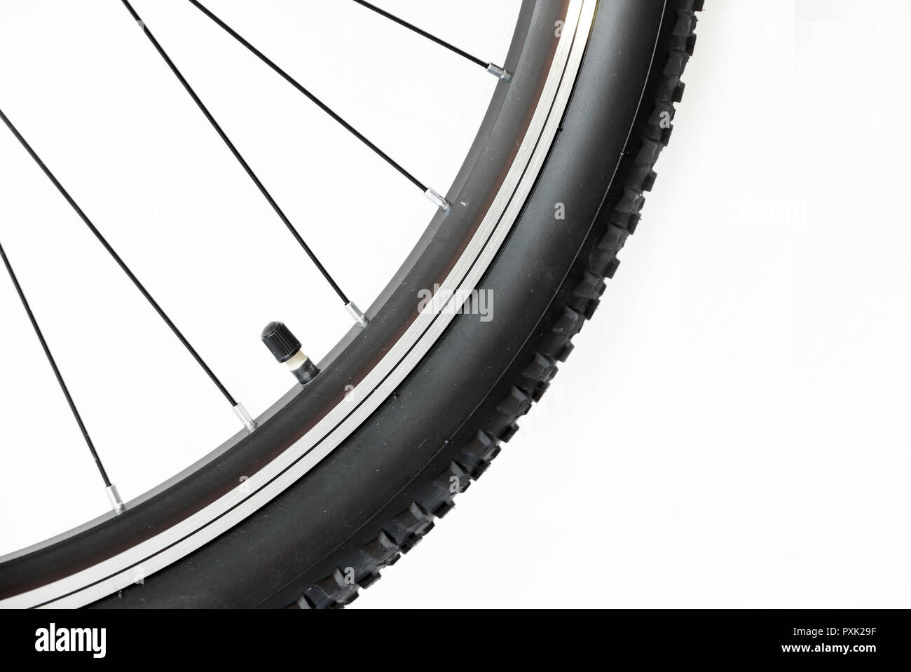 Valce on bicycle wheel isolated on white Stock Photo - Alamy