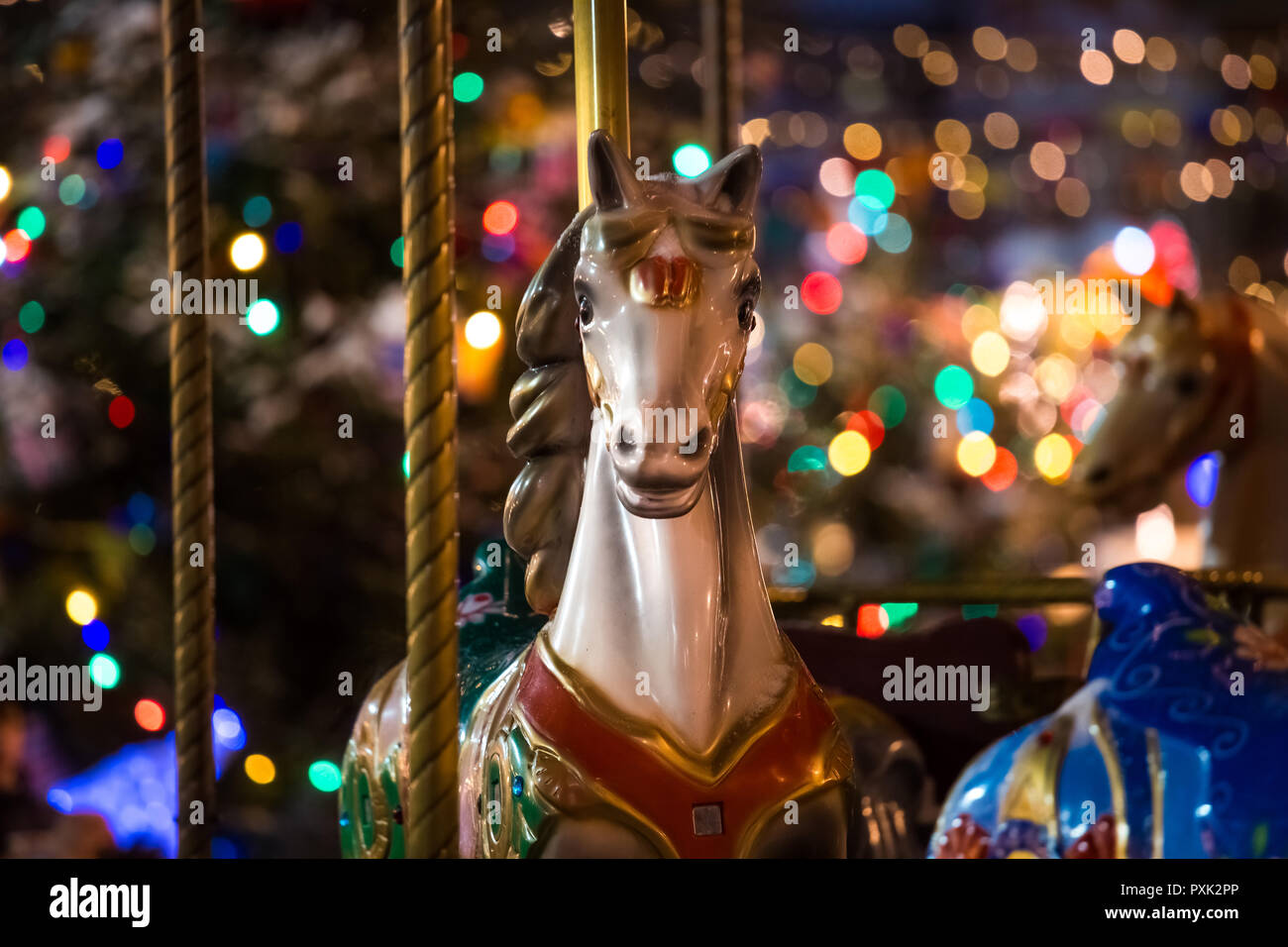 Christmas carousel with rocking horses Stock Photo - Alamy