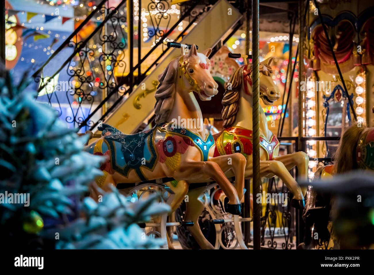Christmas carousel with rocking horses Stock Photo - Alamy