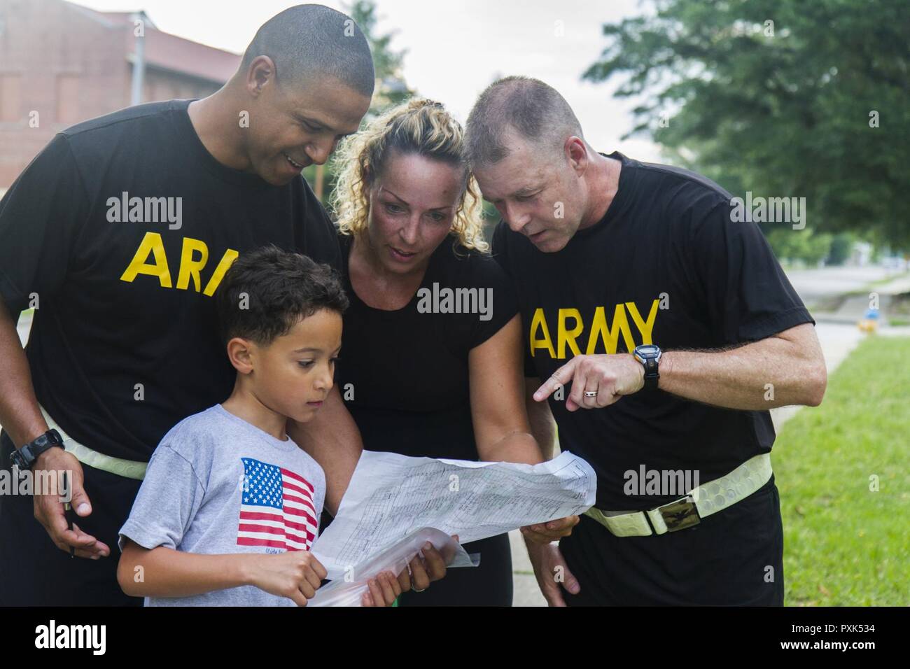 Maj. Ryan Wiggins (left) an operations officer at the U.S. Army Reserve ...
