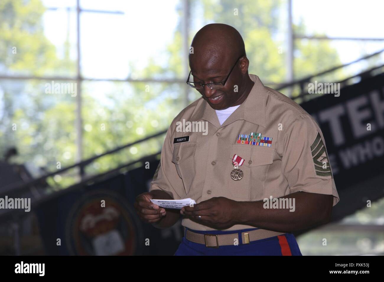 Master Sergeant David Roberts delivers a speech at his retirement ...
