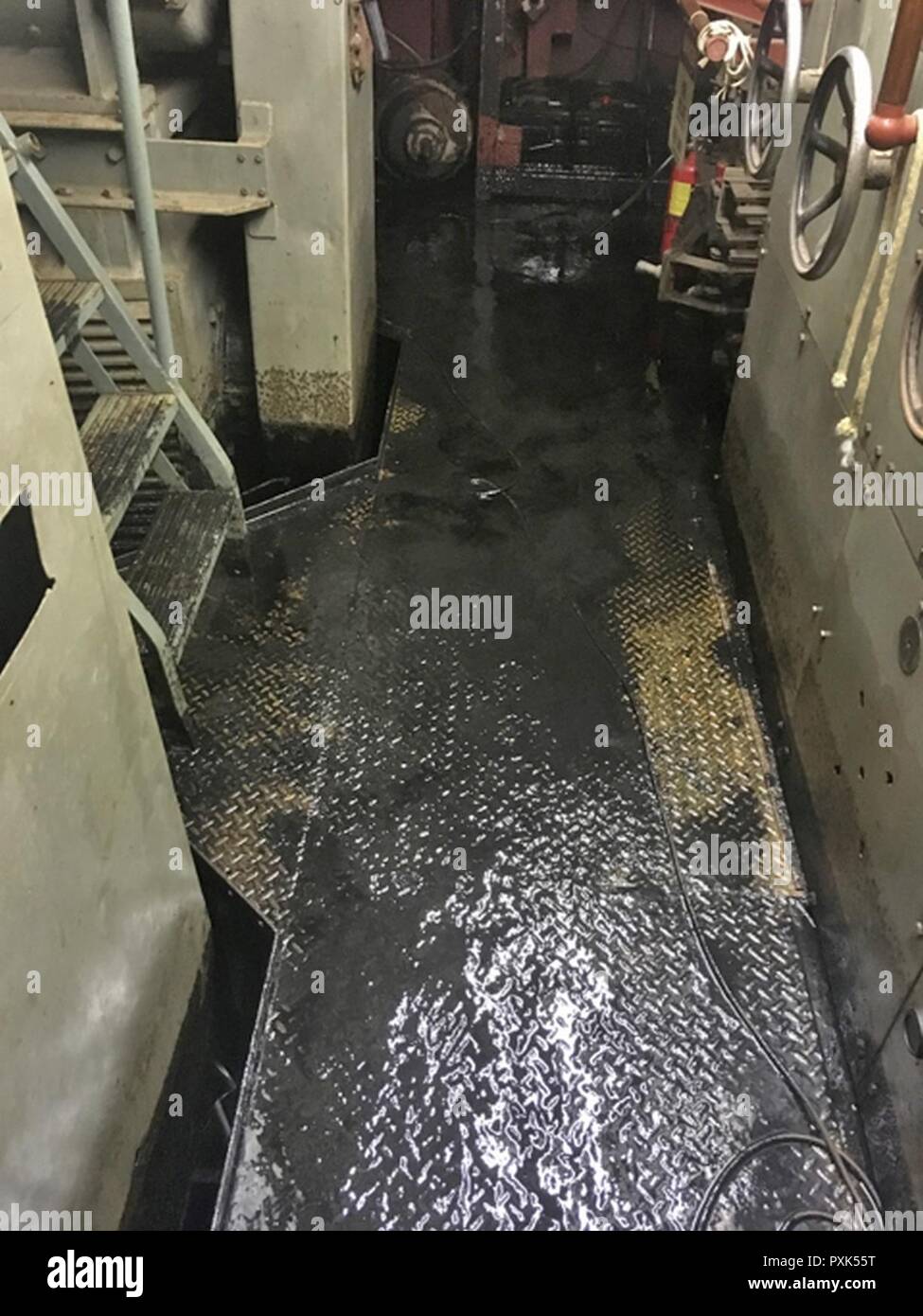 The tubboat Tutahaco's engine room covered in oil and other ...