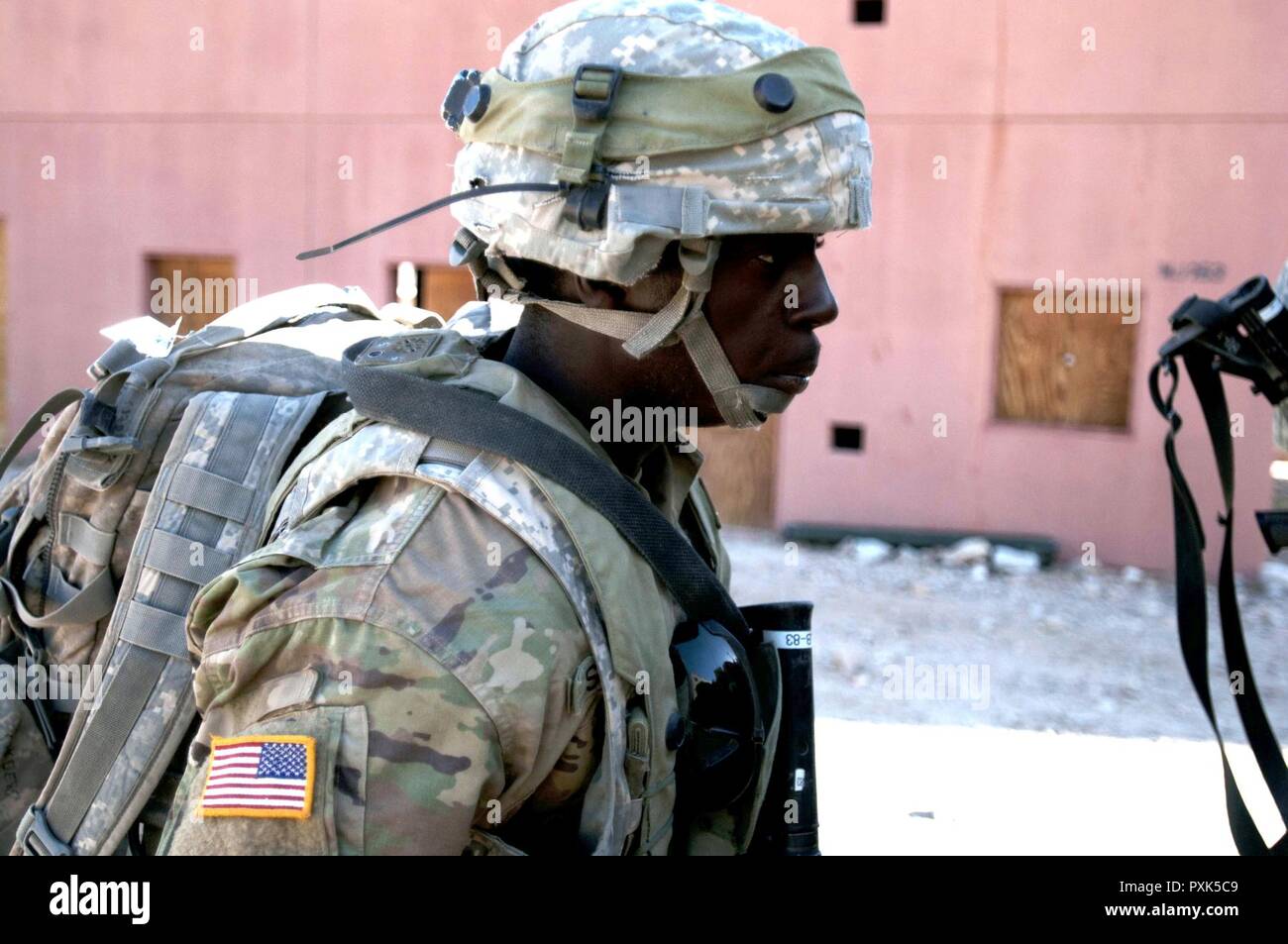 A Soldier with the 155th Armored Brigade Combat Team waits to load into ...
