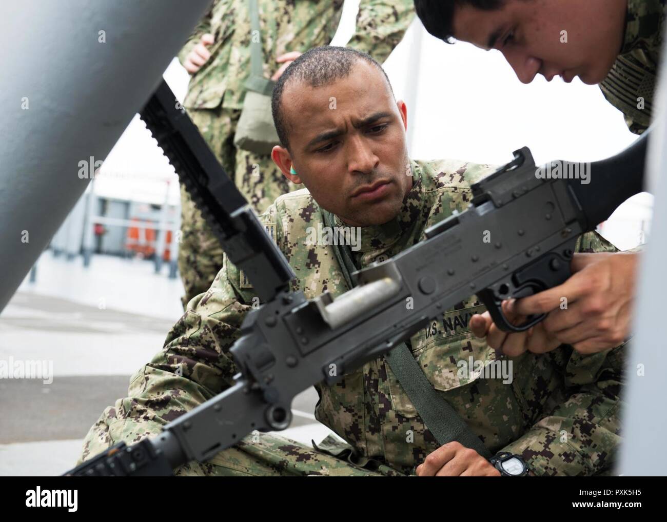 6 SEA OF JAPAN (June 3, 2017) Gunner’s Mate 3rd Class Matthew Holder, right, instructs Hospital ...