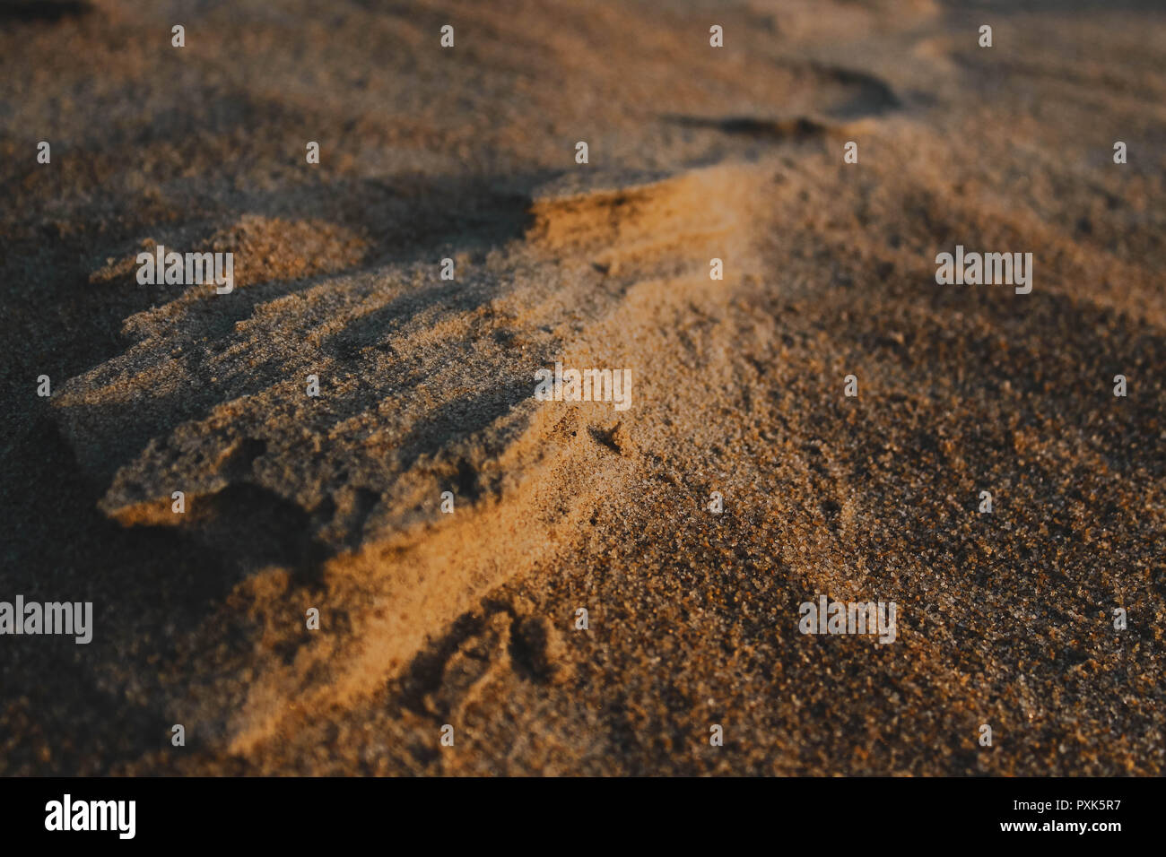 Just sand perfectly piled to look like mountains Stock Photo - Alamy
