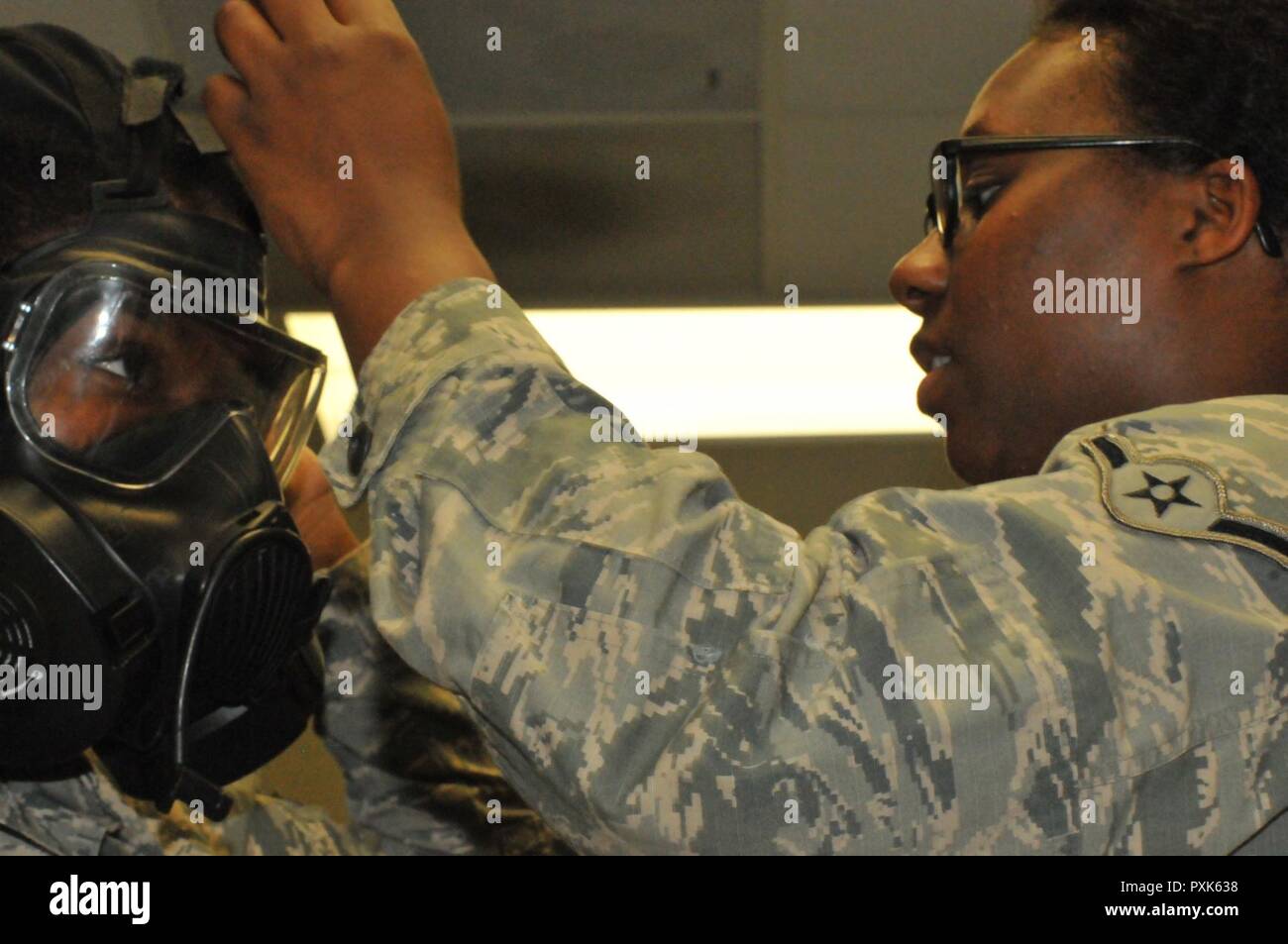 Airman Keyonna Davis (left), 916th Maintenance Squadron, gets ...