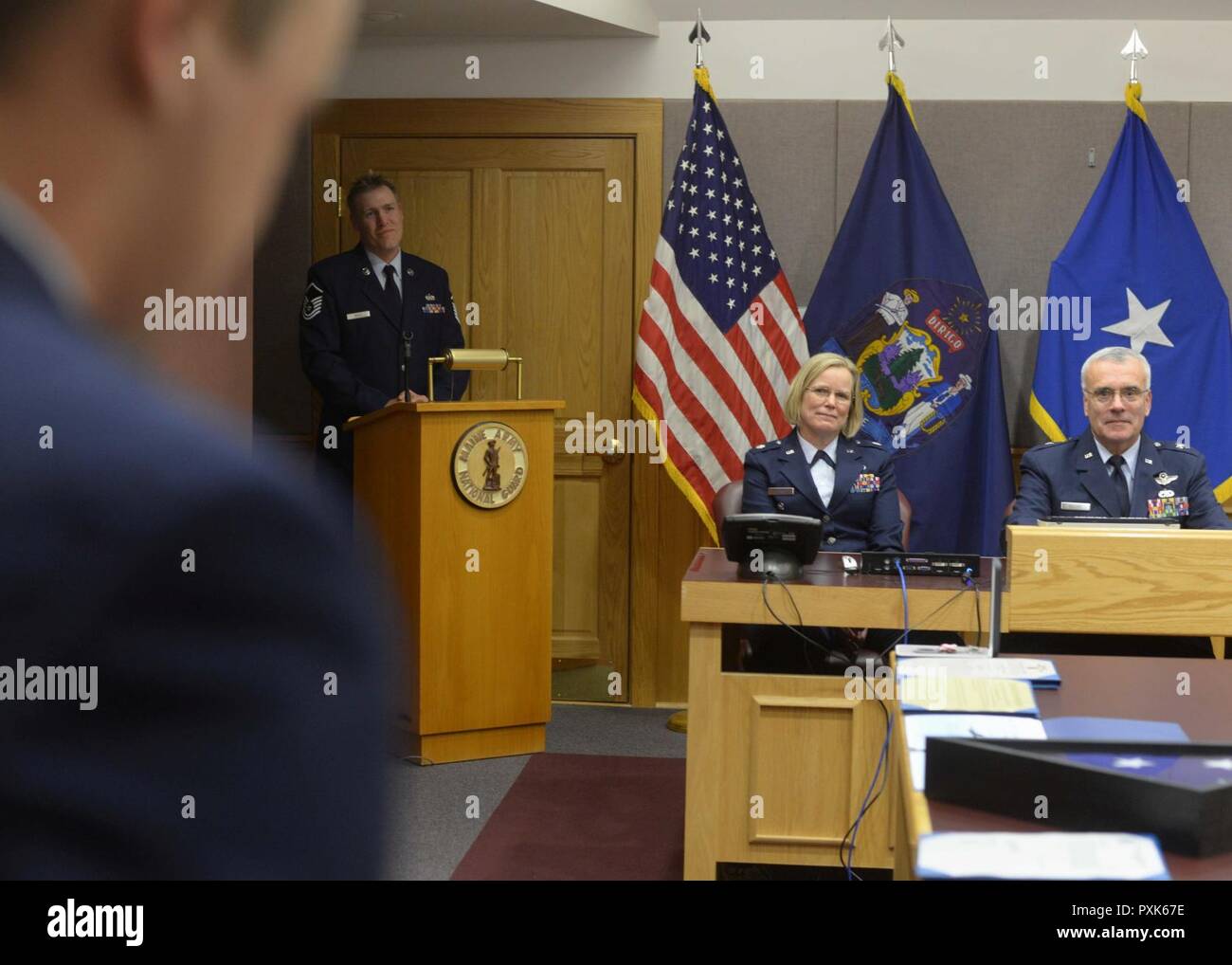 U.S. Air National Guard Senior Amn. Timothy Morris reads the bio of his ...