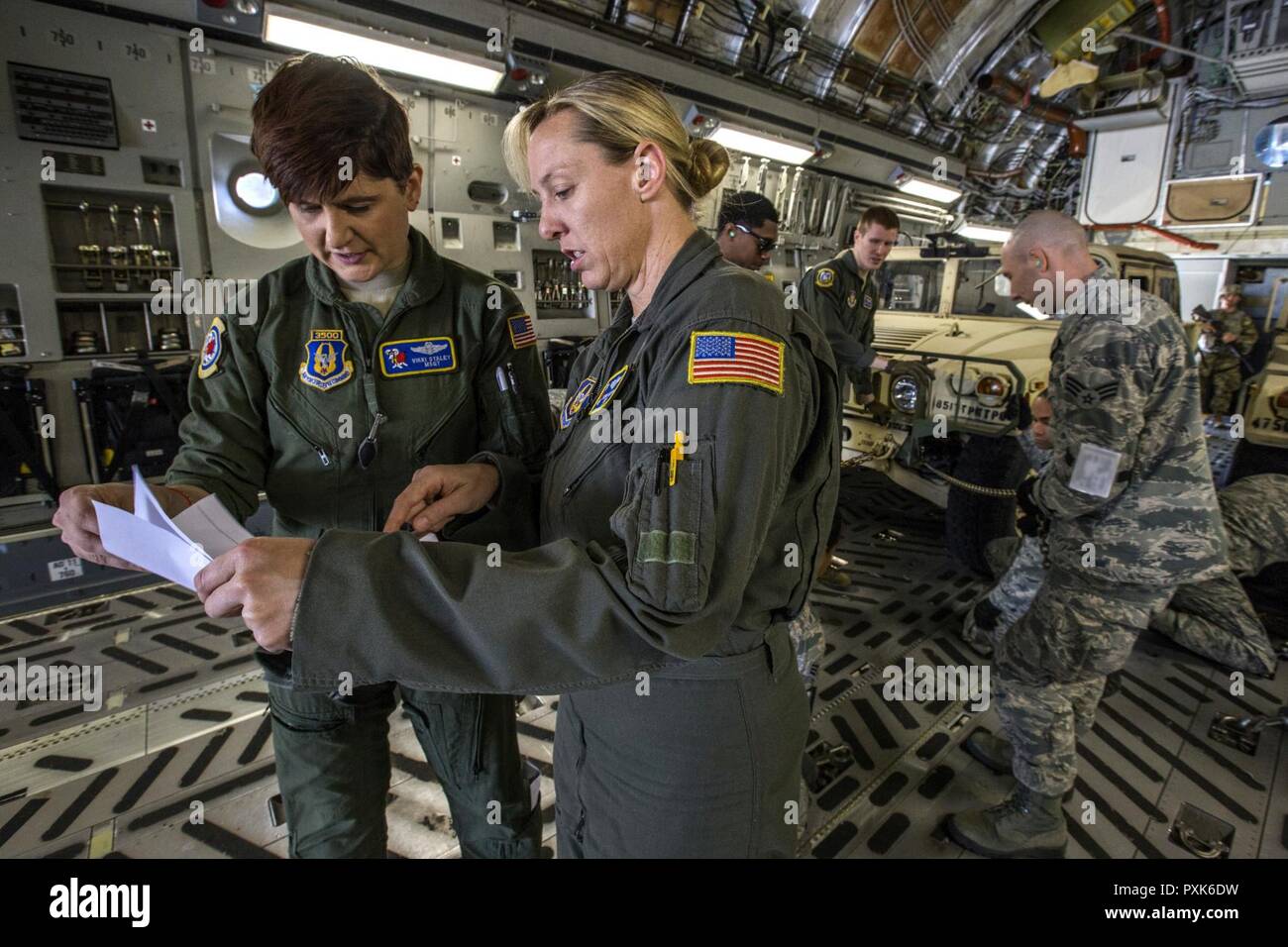 U.S. Air Force Loadmasters Master Sgt. Victoria D. Staley, left, and ...