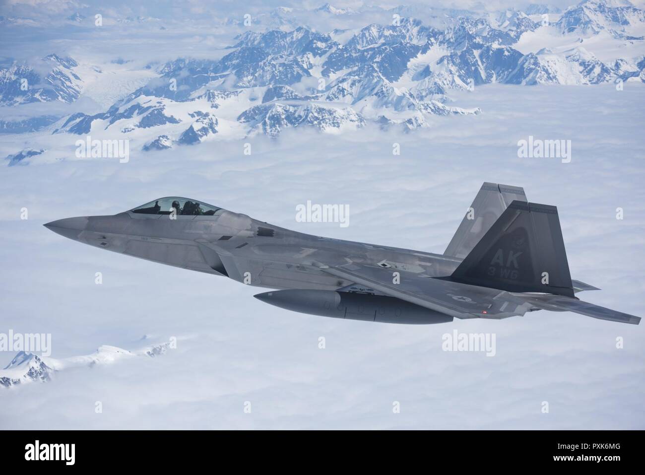 An F-22 Raptor from the 3rd Wing, U.S. Air Force Reserves, escorts the ...