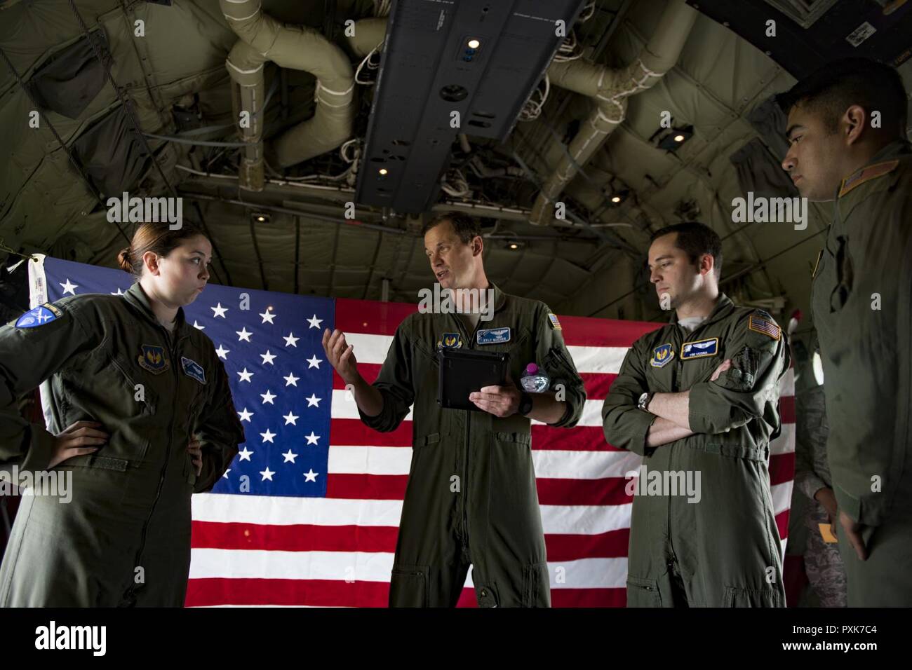 U.S. Air Force Maj. Kyle Bucher, 37th Airlift Squadron pilot, briefs ...