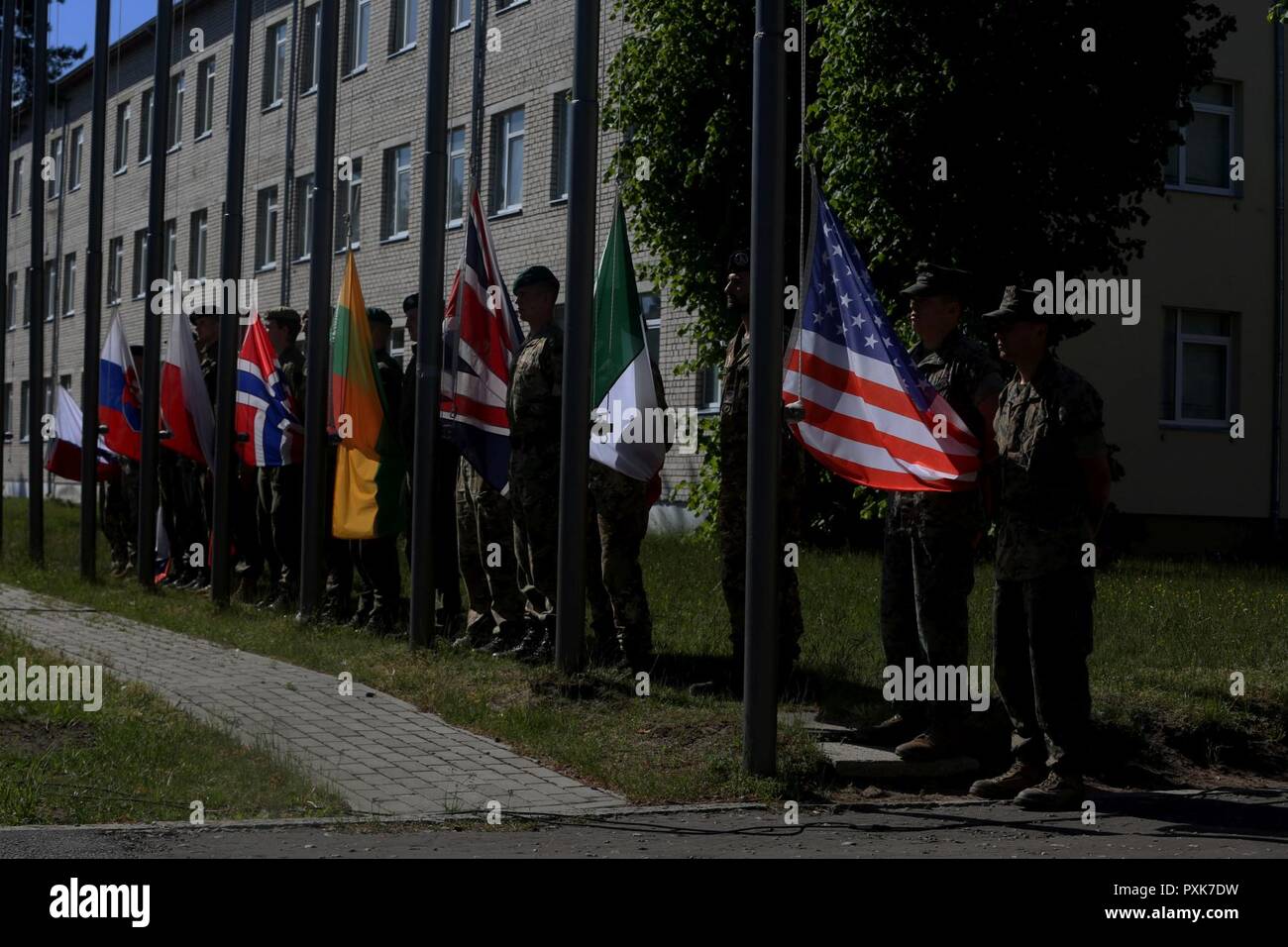 Ally and partner nations stand together before the flag raising during ...