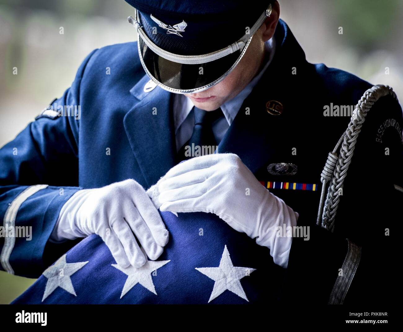 Airman Kyle Kruger, 96th Comptroller Squadron, ensures the flag is ...