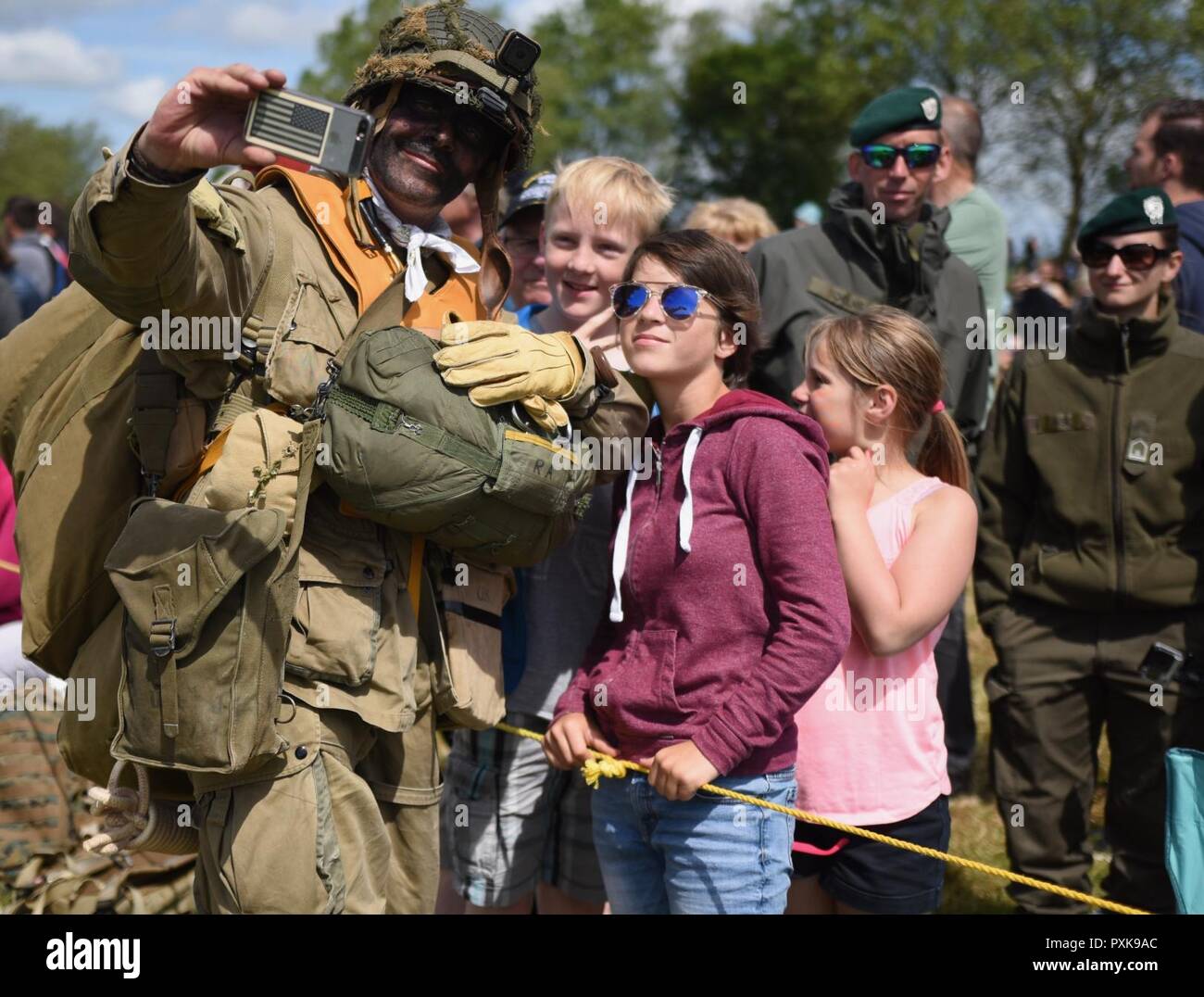 A member of the Liberty Jump Team takes a selfie with French spectators ...